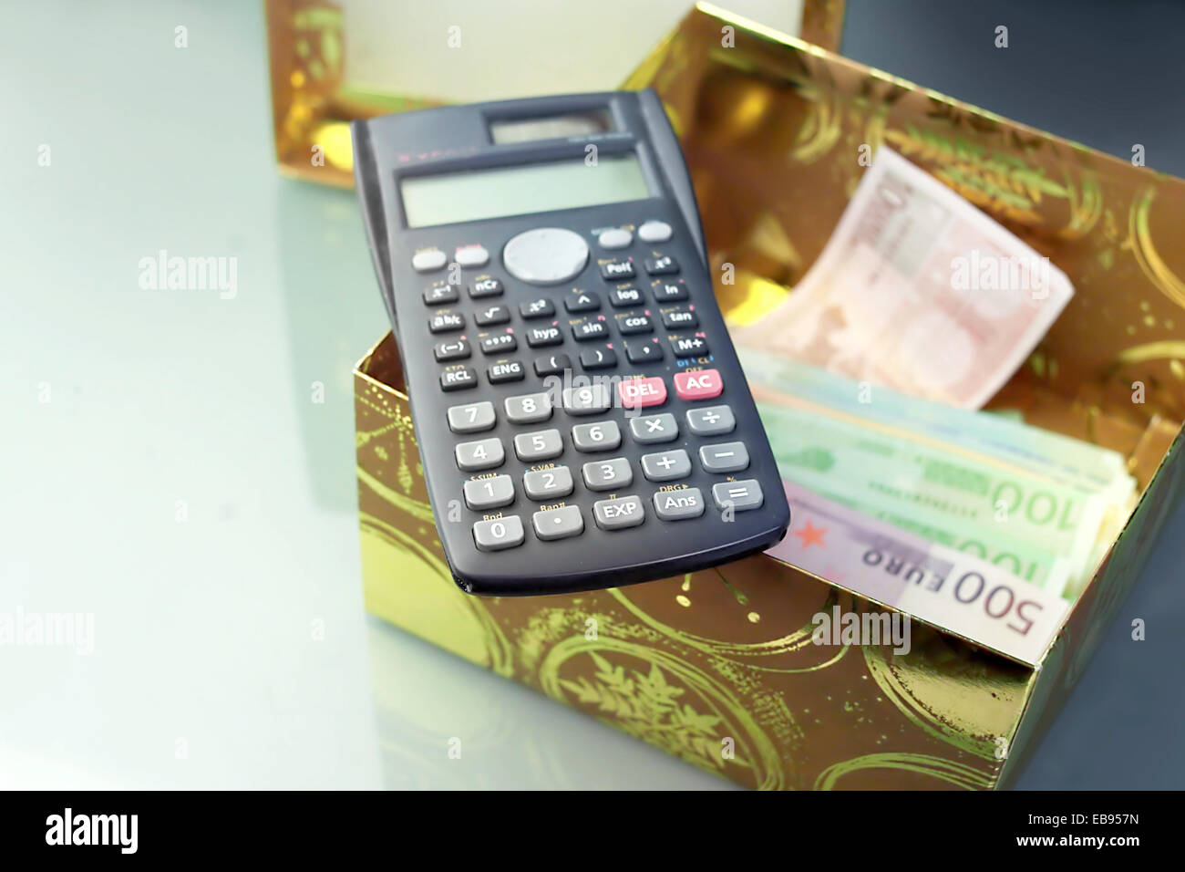 Calculator and Money Stock Photo - Alamy