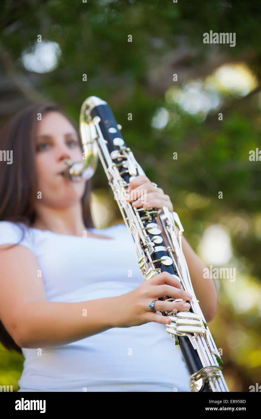 Adult woman female musician playing clarinet hi-res stock photography ...