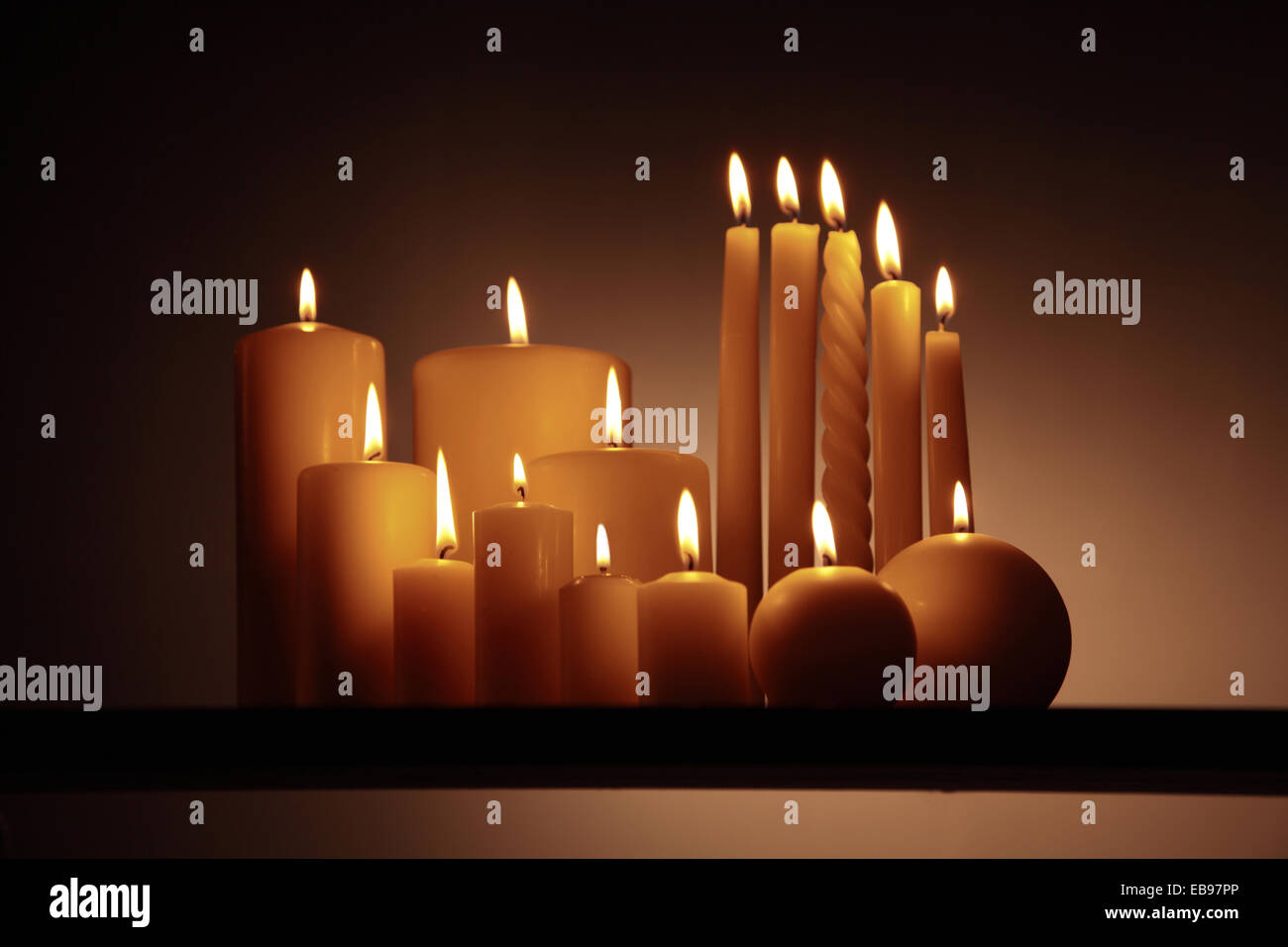 group 15 candles on wooden surface Stock Photo - Alamy