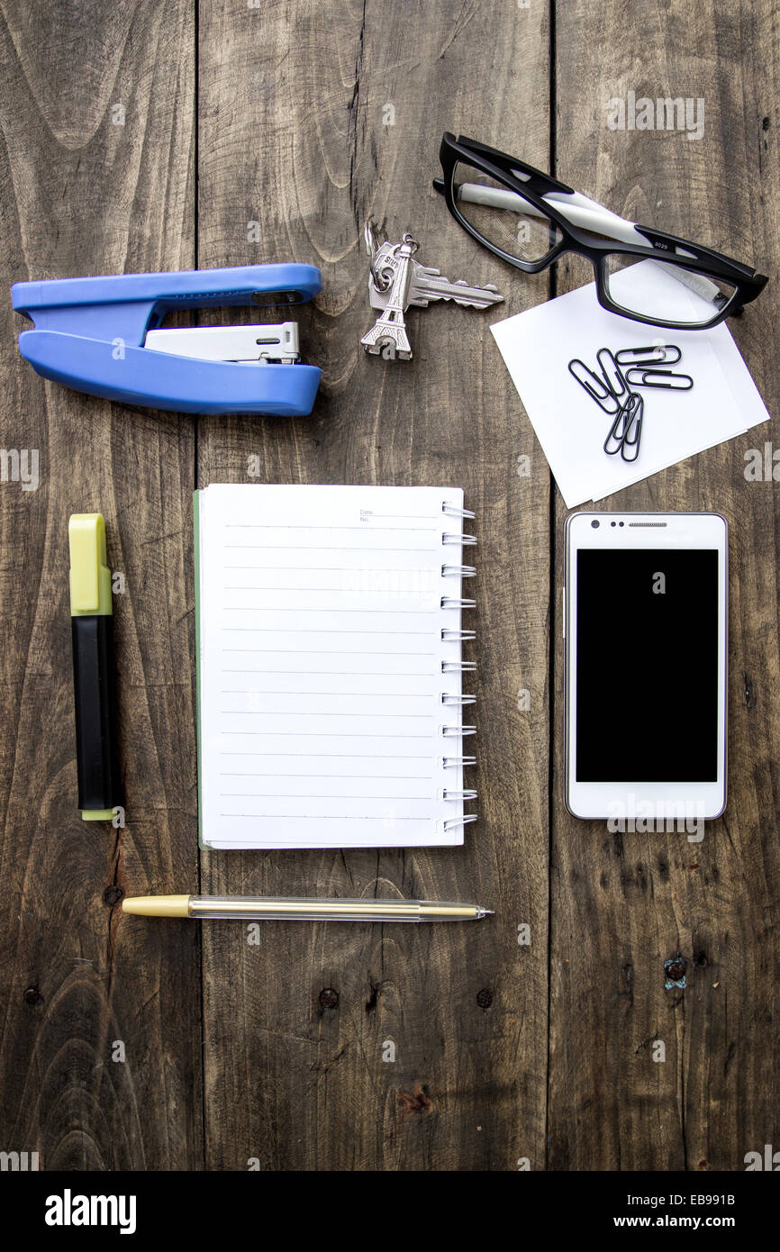 Different business objects on wooden desk. From above Stock Photo - Alamy