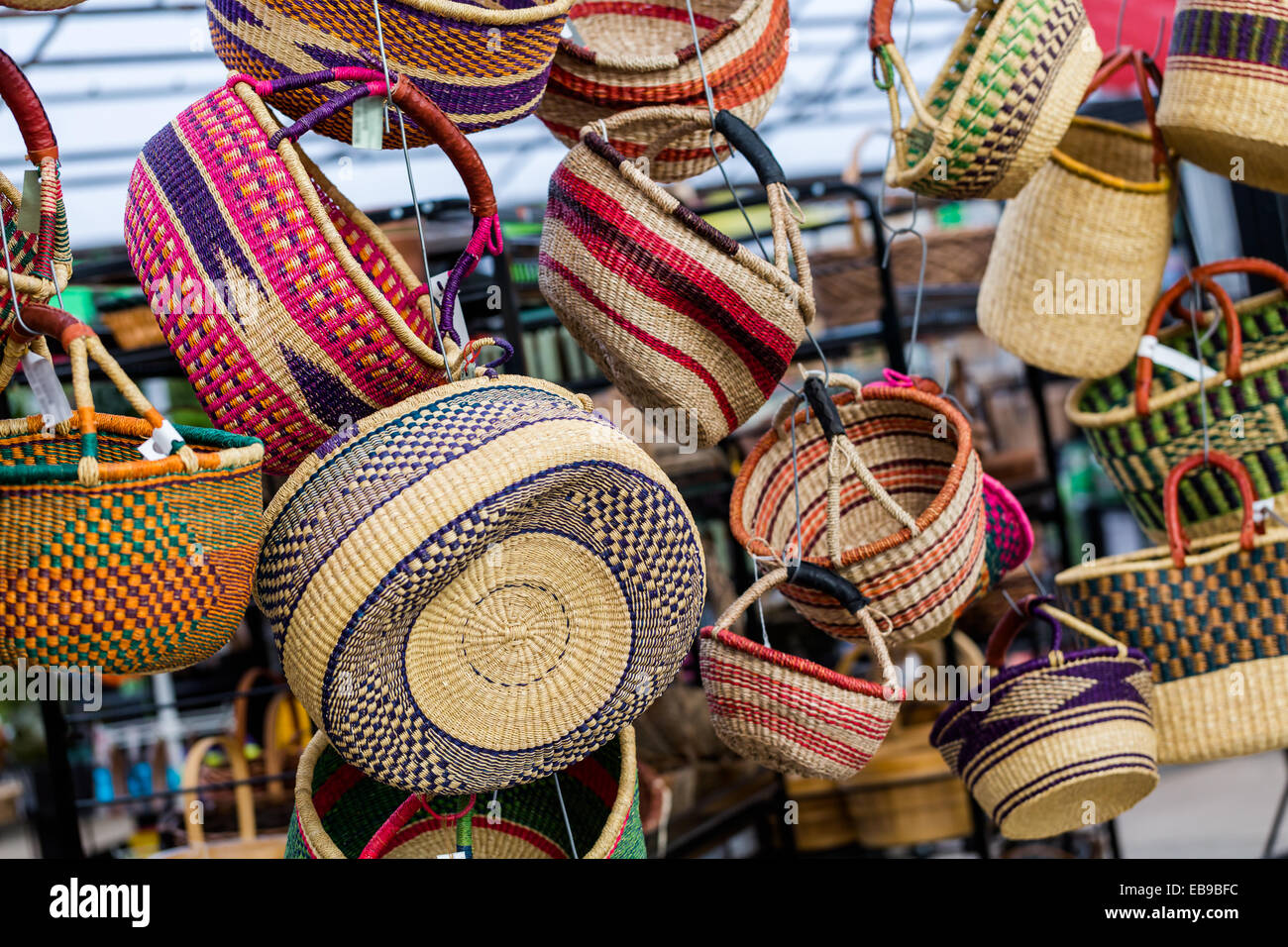 Handmade colorful baskets hanged for display Stock Photo - Alamy
