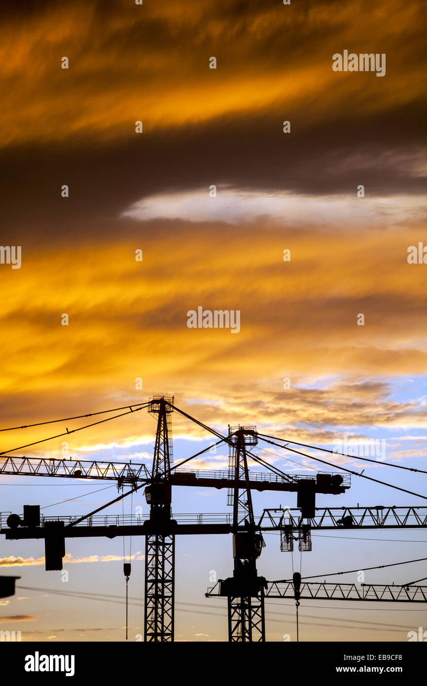 Color picture of some cranes on a construction site, as dusk Stock ...