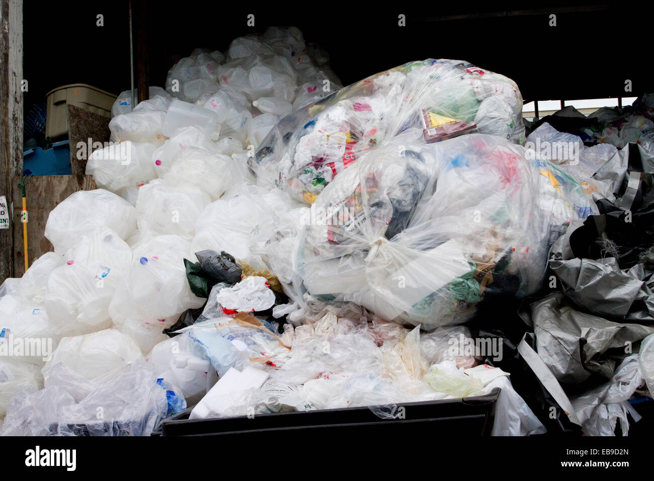 Bags of used plastic bottles and other plastics at a Recycling Depot ...