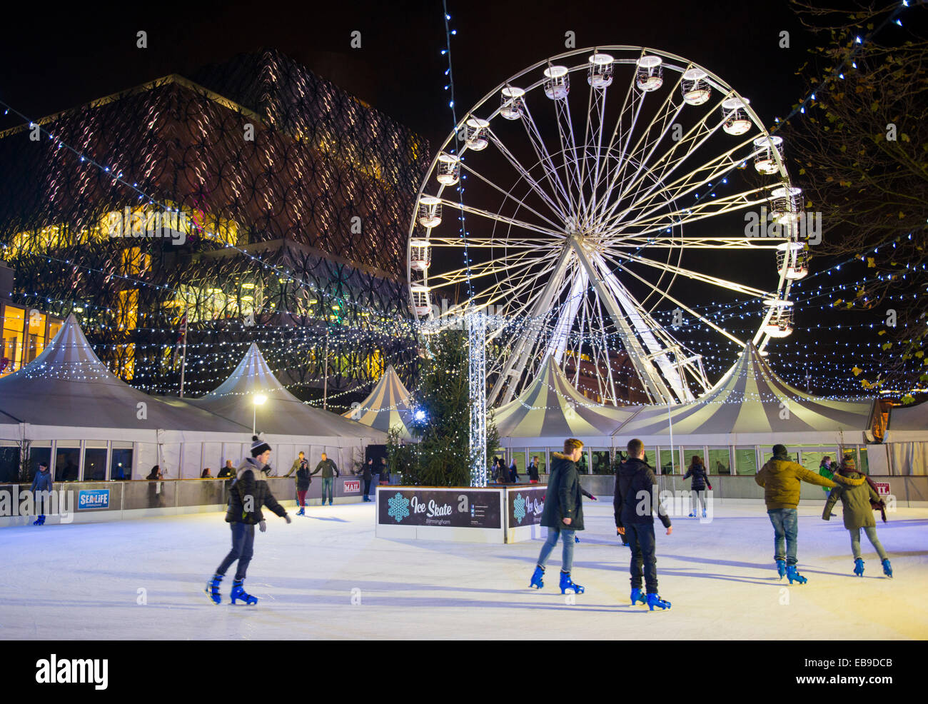 People enjoying Birmingham's Big Wheel and ice skating rink infront of ...