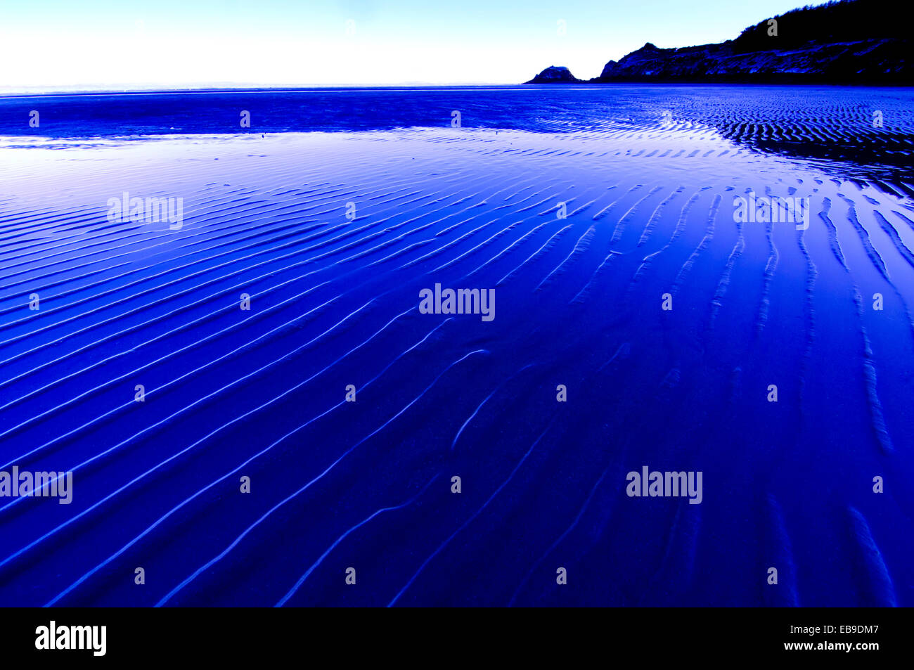 UK, Wales, Pembrokeshire, Saundersfoot beach ripples winter Monkstone ...
