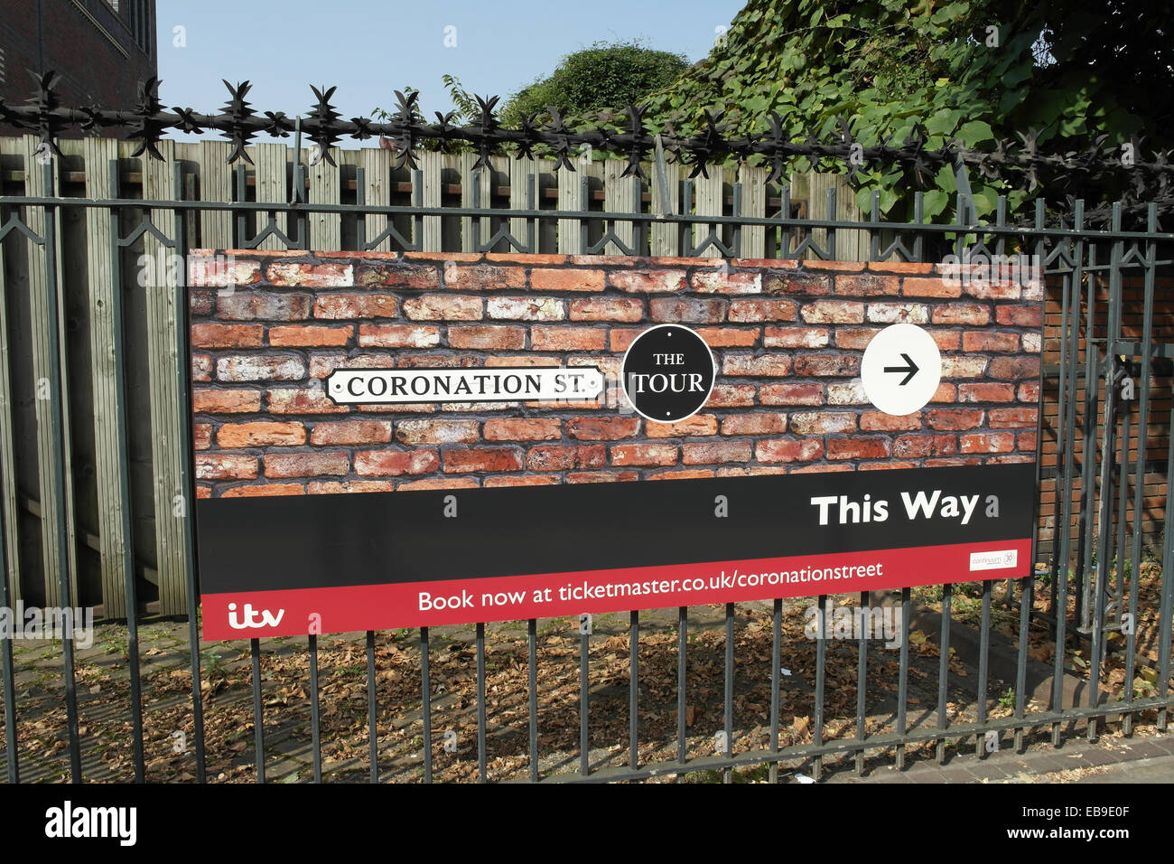 Blue sky view large directional sign 'Coronation Street The Tour ...
