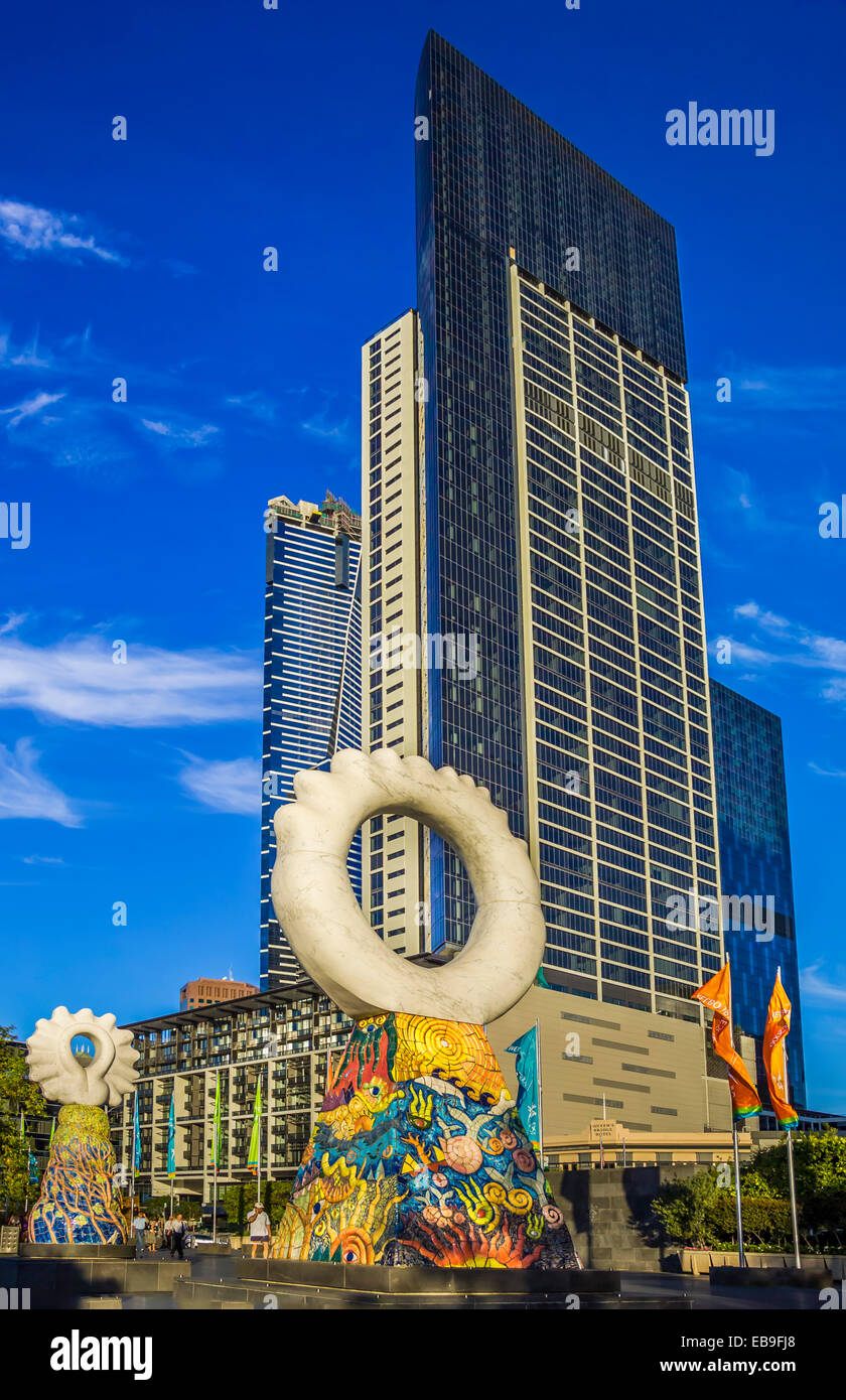 'The Guardians' sculpture by Simon Rigg, against skyscrapers, Southbank ...