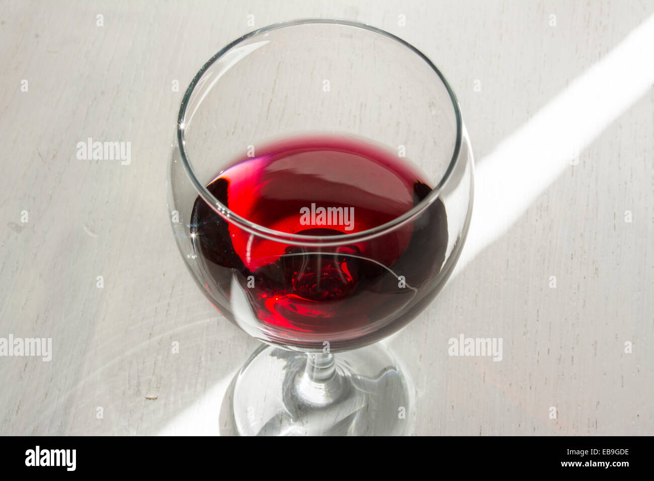 glass of red wine, liquid detail on white background Stock Photo - Alamy