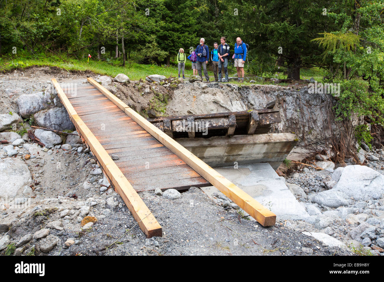 A bridge destroyed by flash flooding below La Fouly in the Swiss Alps ...