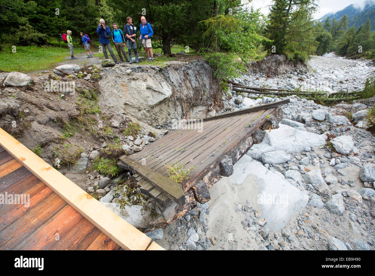 A bridge destroyed by flash flooding below La Fouly in the Swiss Alps ...