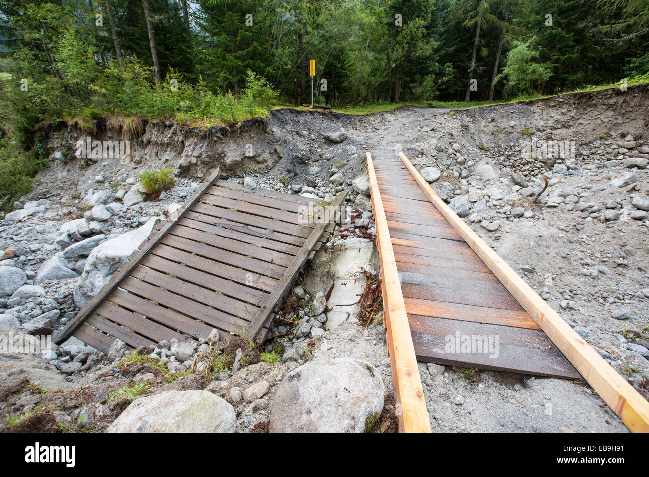 A bridge destroyed by flash flooding below La Fouly in the Swiss Alps ...