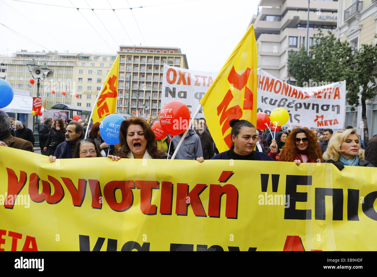 Protesters march through Athens, shouting slogans. Tens of thousands ...