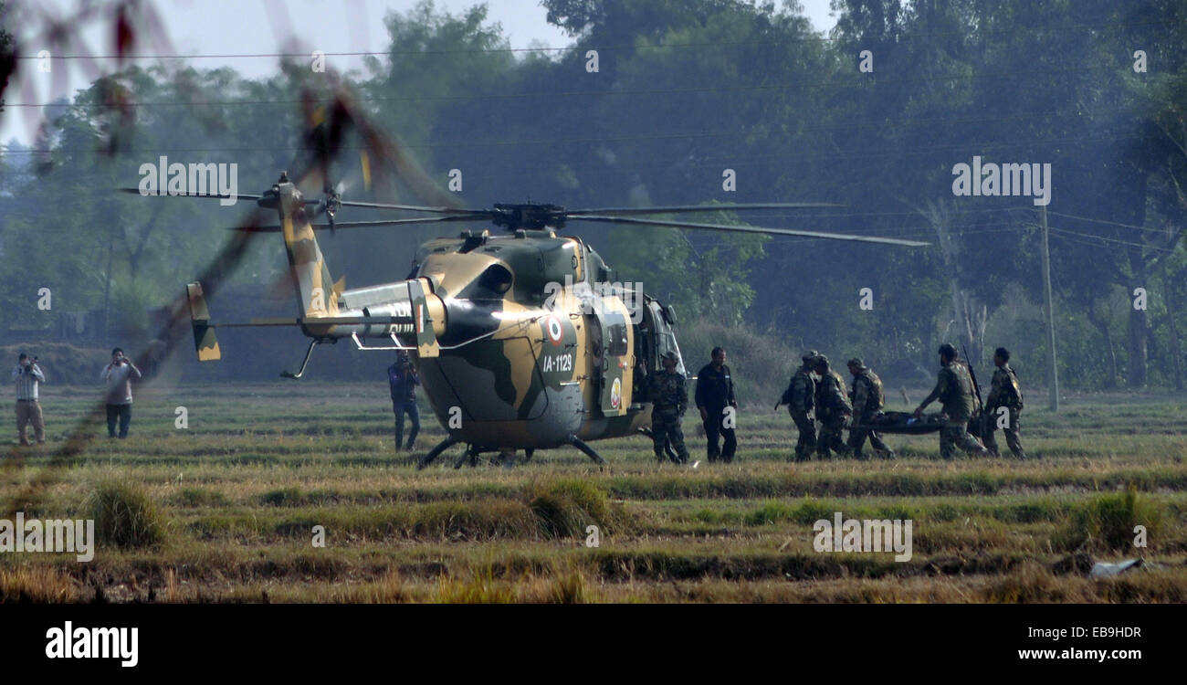 Indian Army men help evacuate a wounded soldier to an army helicopter ...
