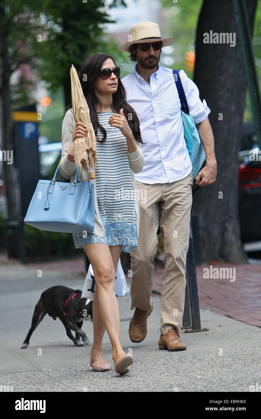 Famke Janssen and Cole Frates leave Bar Pitti in the West Village and ...