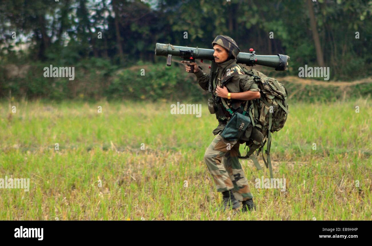 Indian Army soldiers take positions during the ongoing encounter ...