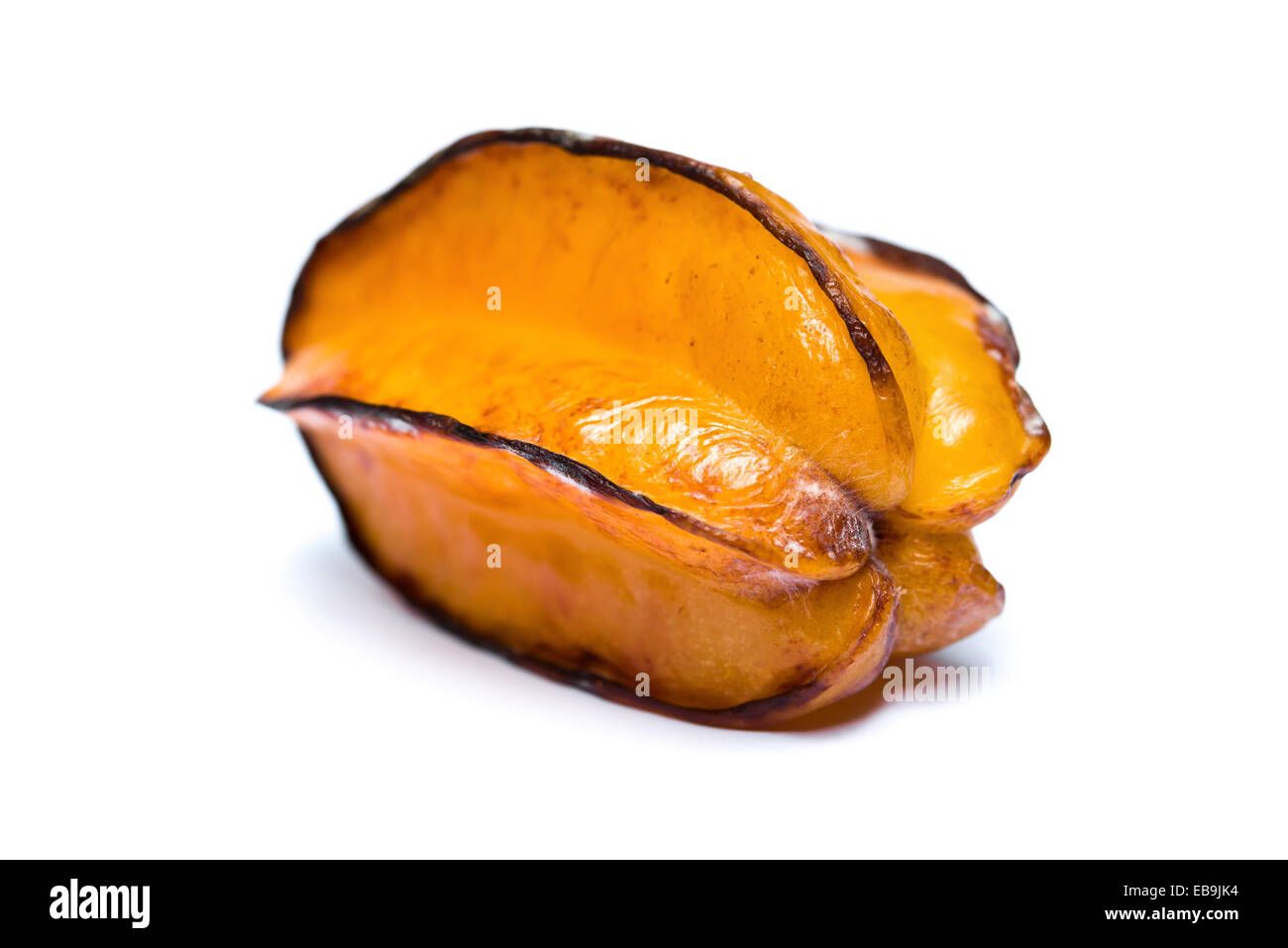 over-ripe starfruit on a white background Stock Photo - Alamy