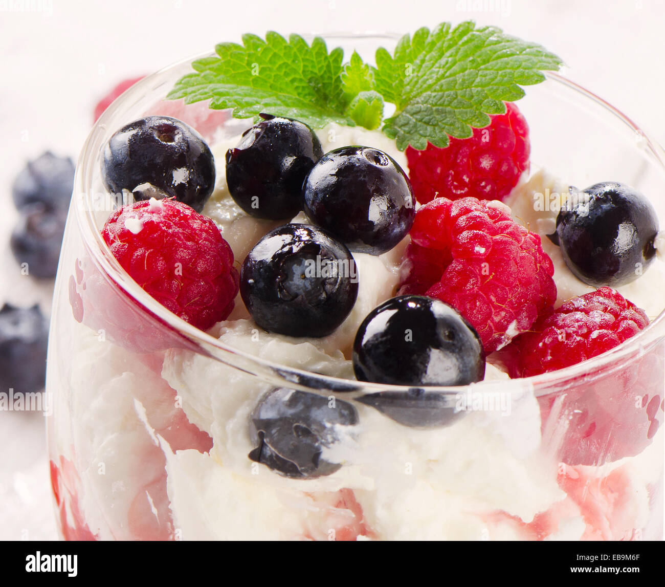 Delicious dessert with fresh berries and mint Stock Photo - Alamy
