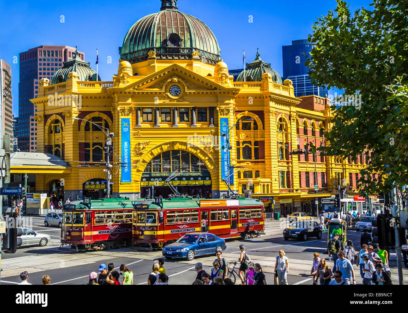 Two heritage burgundy and green trams on the free City loop in front of ...