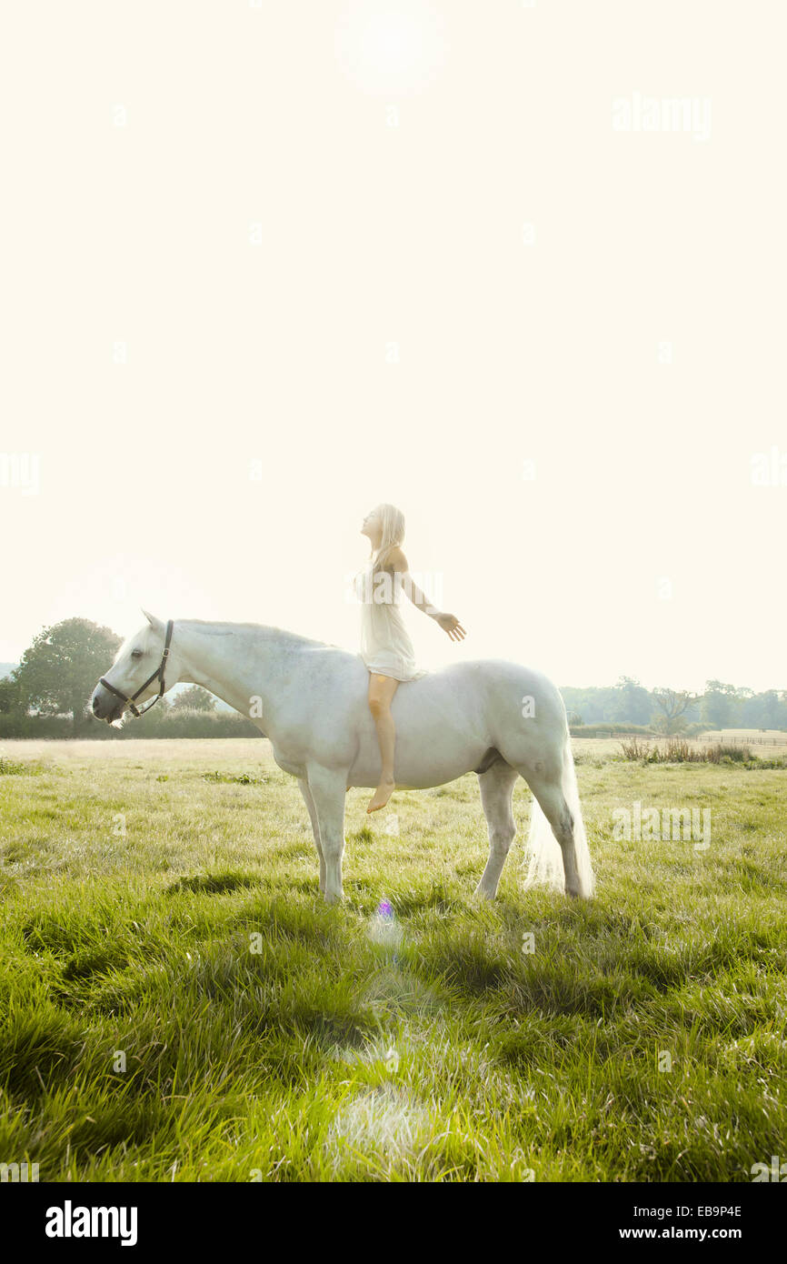 Young woman riding horse hi-res stock photography and images - Alamy