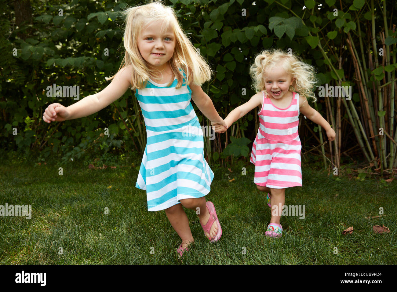Children holding hands running hi-res stock photography and images - Alamy