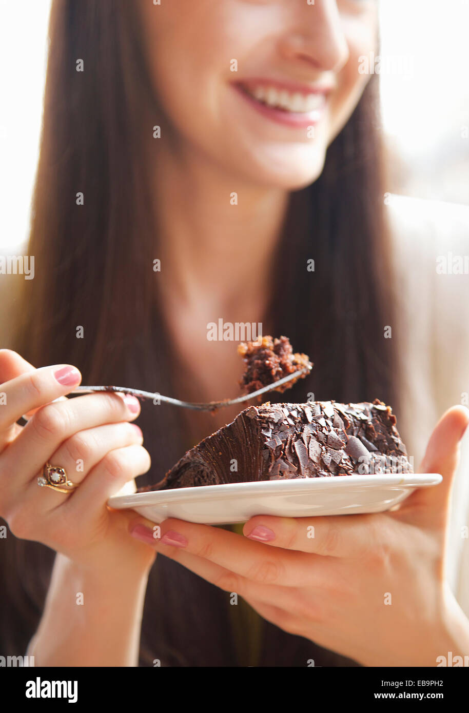Close up of Woman Eating Chocolate Cake Stock Photo - Alamy