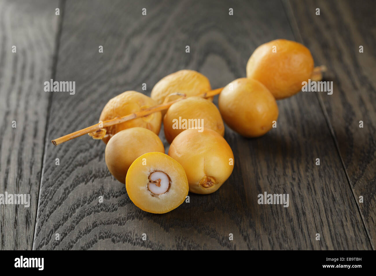 fresh raw dates on table, old oak wood Stock Photo - Alamy