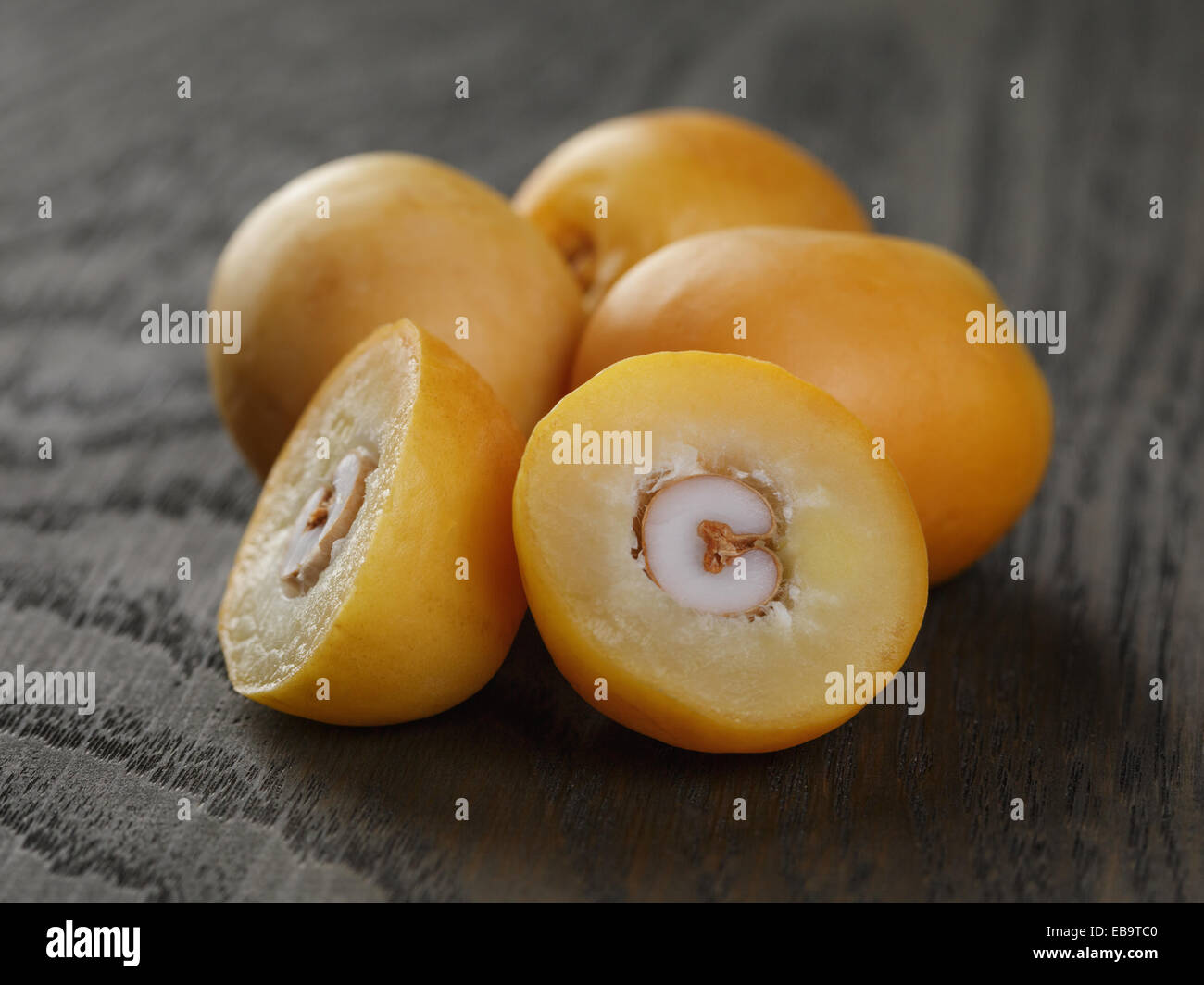fresh raw dates on table, old oak wood Stock Photo - Alamy