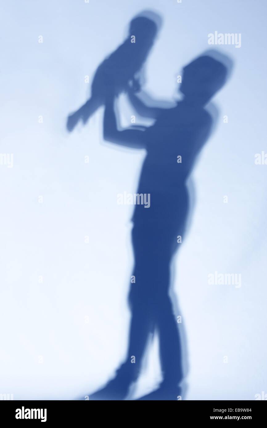 Shadow, Father with baby Stock Photo - Alamy