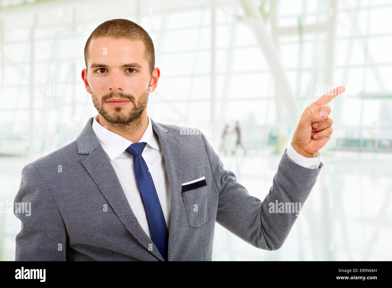 businessman pointing with his finger, at the office Stock Photo - Alamy