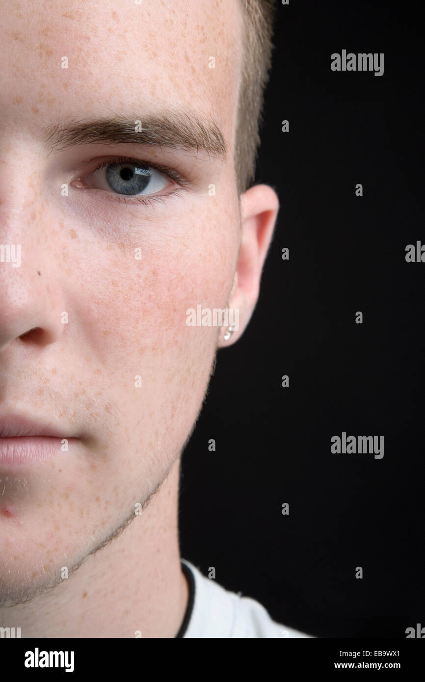 Teenage boy looking serious Stock Photo - Alamy