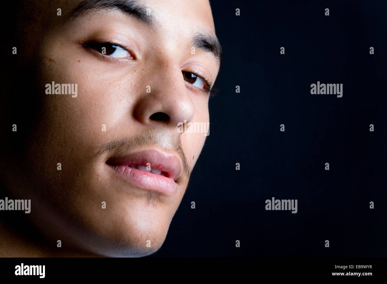 Teenage boy looking serious Stock Photo - Alamy