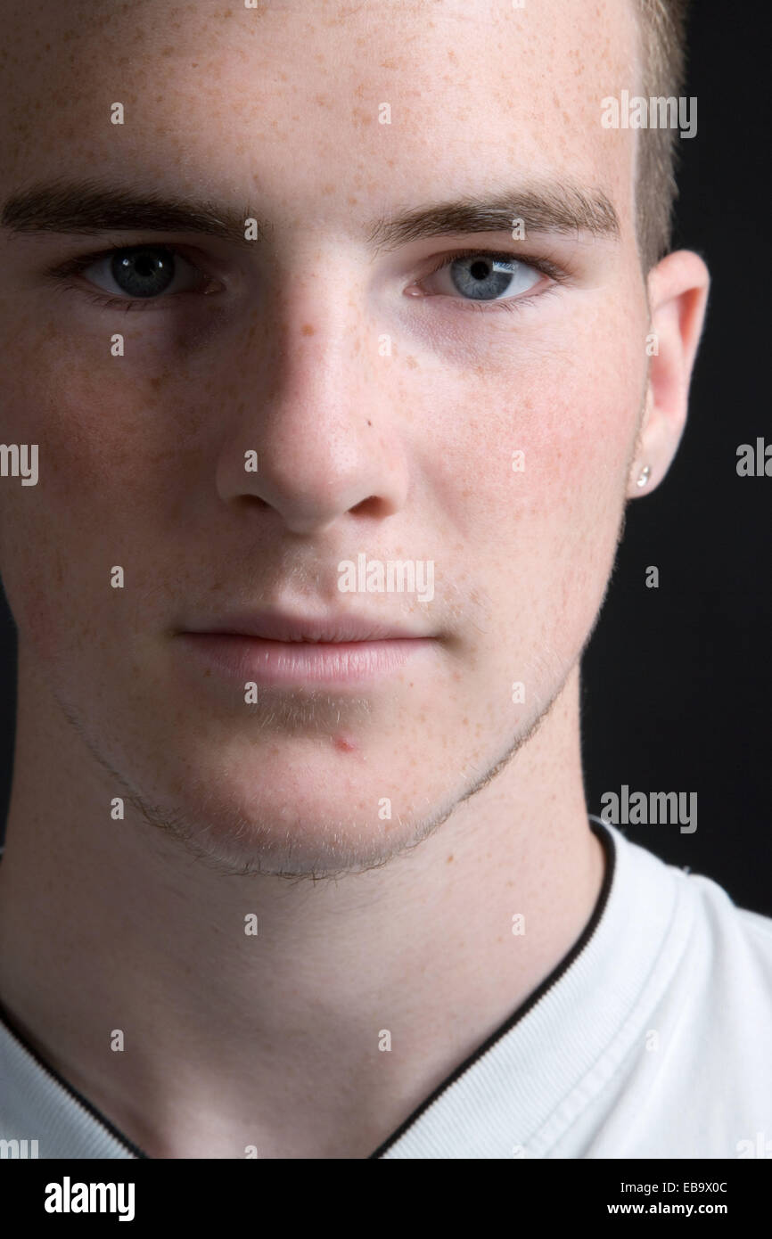 Teenage boy looking serious Stock Photo - Alamy