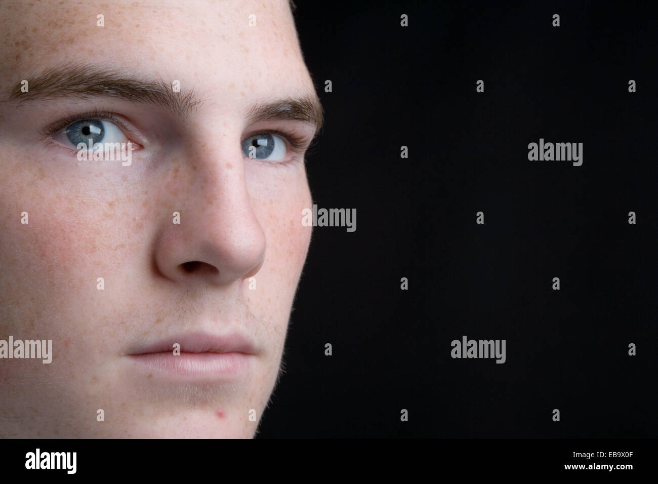 Teenaged boy looking serious Stock Photo - Alamy