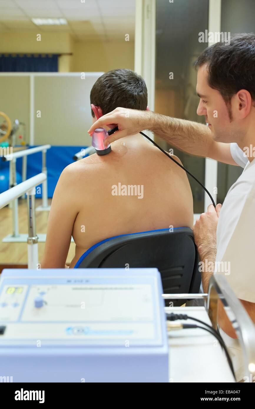 Ultrasound treat trapezius muscle contractures hi-res stock photography ...