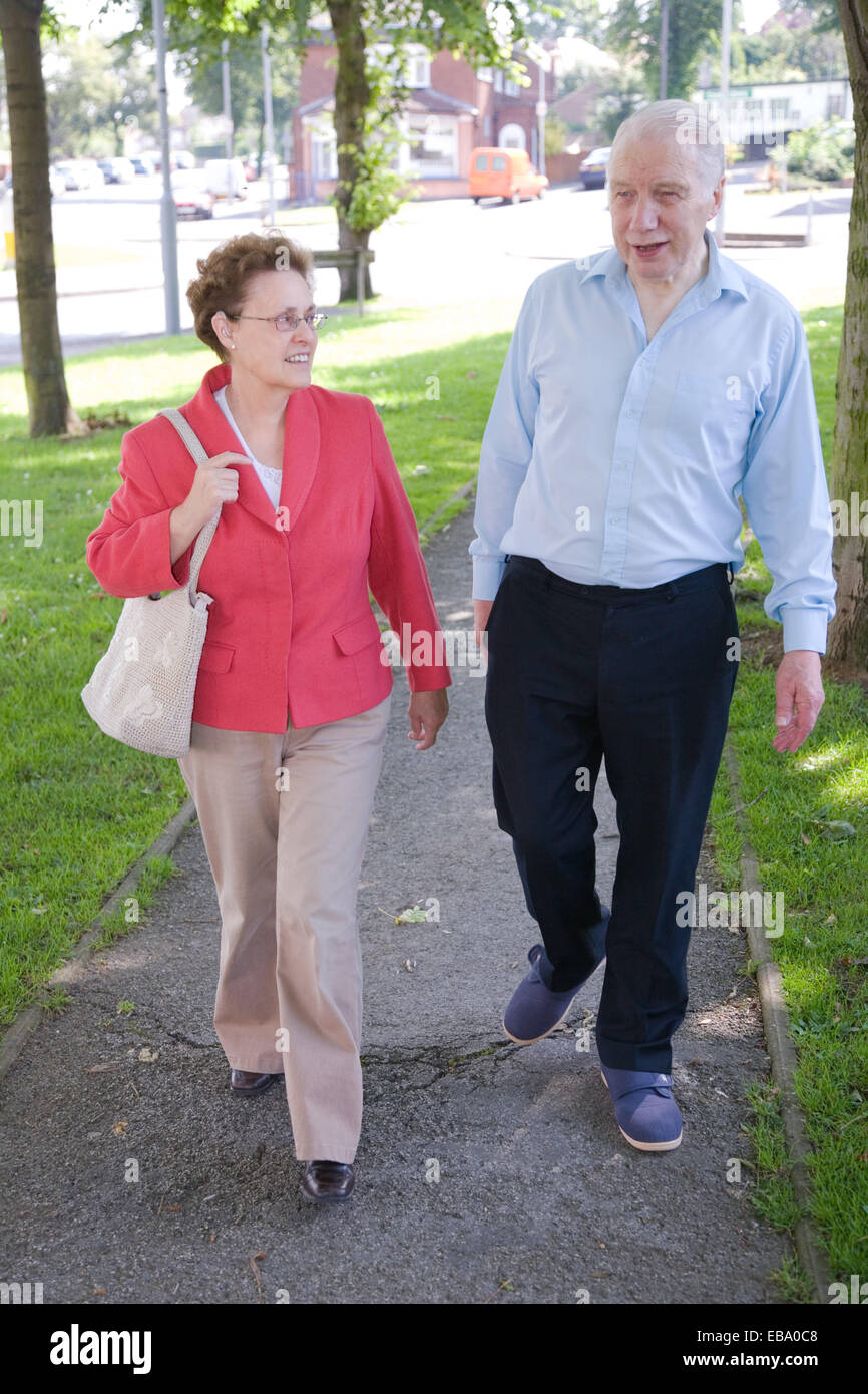 Older couple out walking together Stock Photo - Alamy