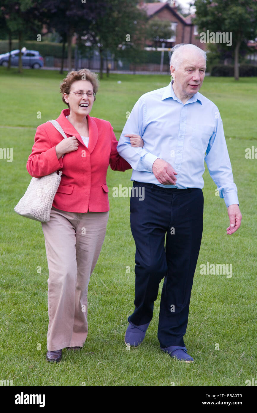 Walking linking arms hi-res stock photography and images - Alamy