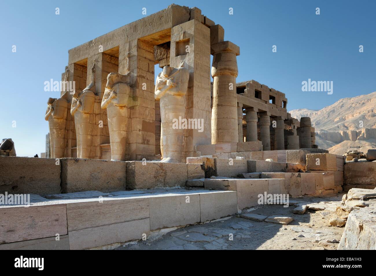 Facade with columns and Osiris statues in front of the Ramesseum ...