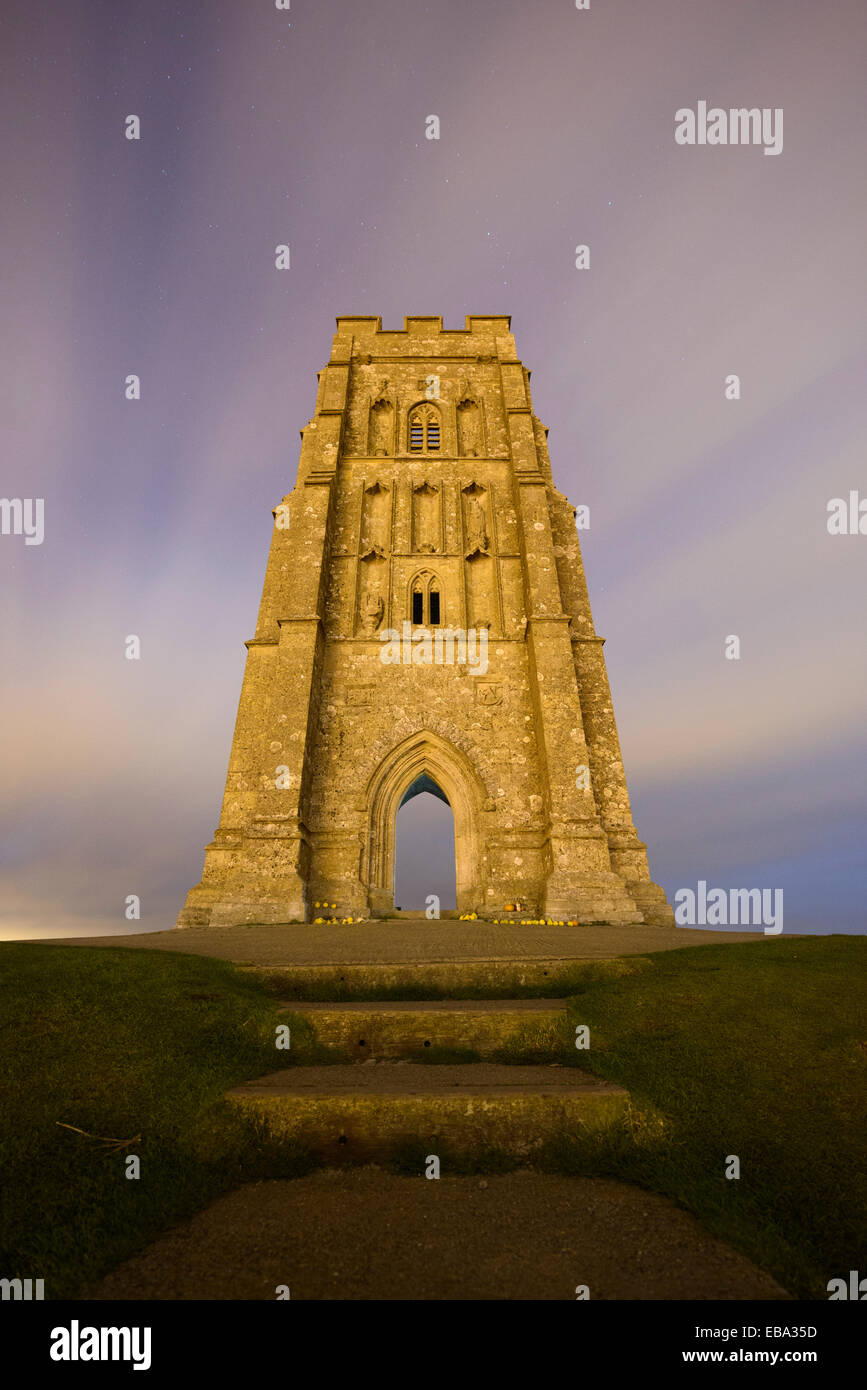 Glastonbury Tor, Somerset, at night with clouds and stars overhead ...