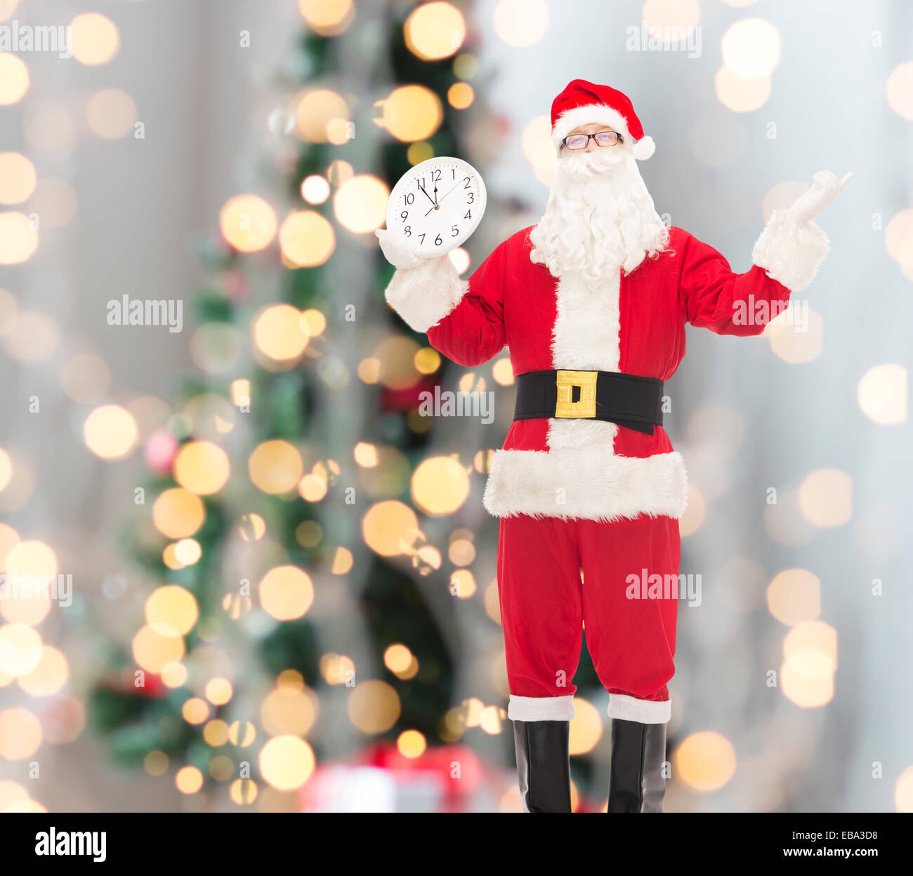 Happy santa pointing clock showing hi-res stock photography and images ...