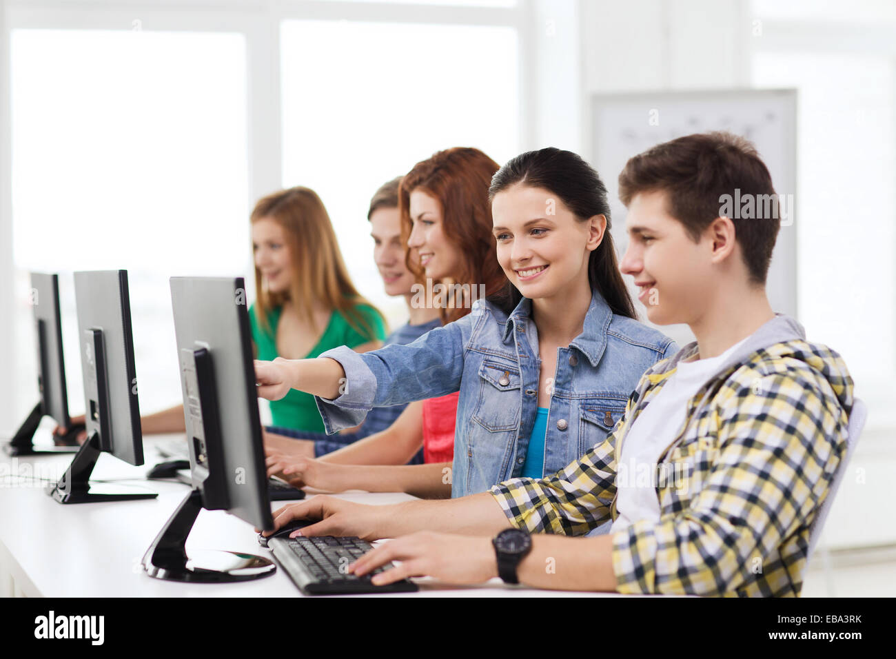 male student with classmates in computer class Stock Photo - Alamy