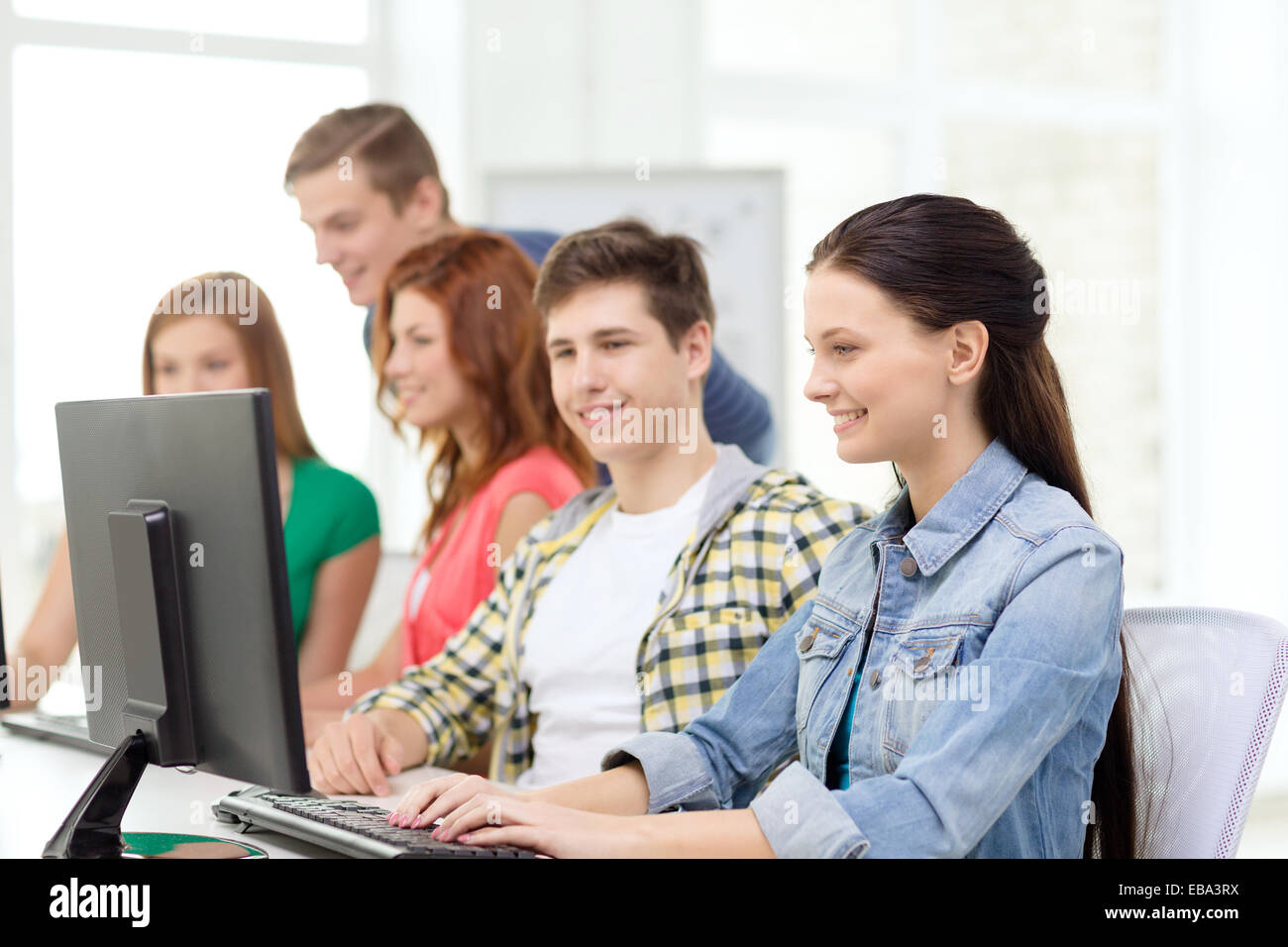 female student with classmates in computer class Stock Photo - Alamy
