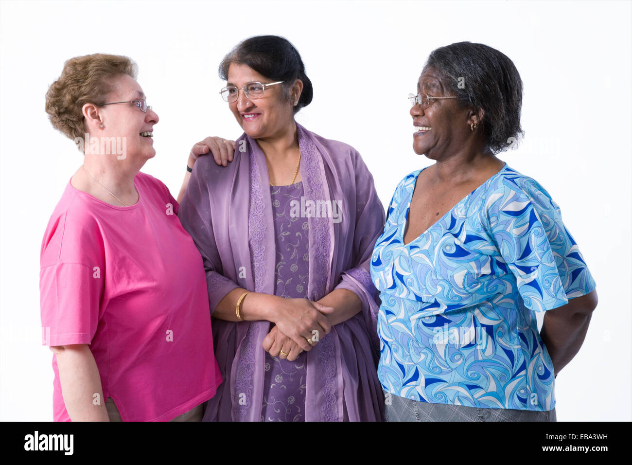 Multiracial group of older women chatting together Stock Photo - Alamy