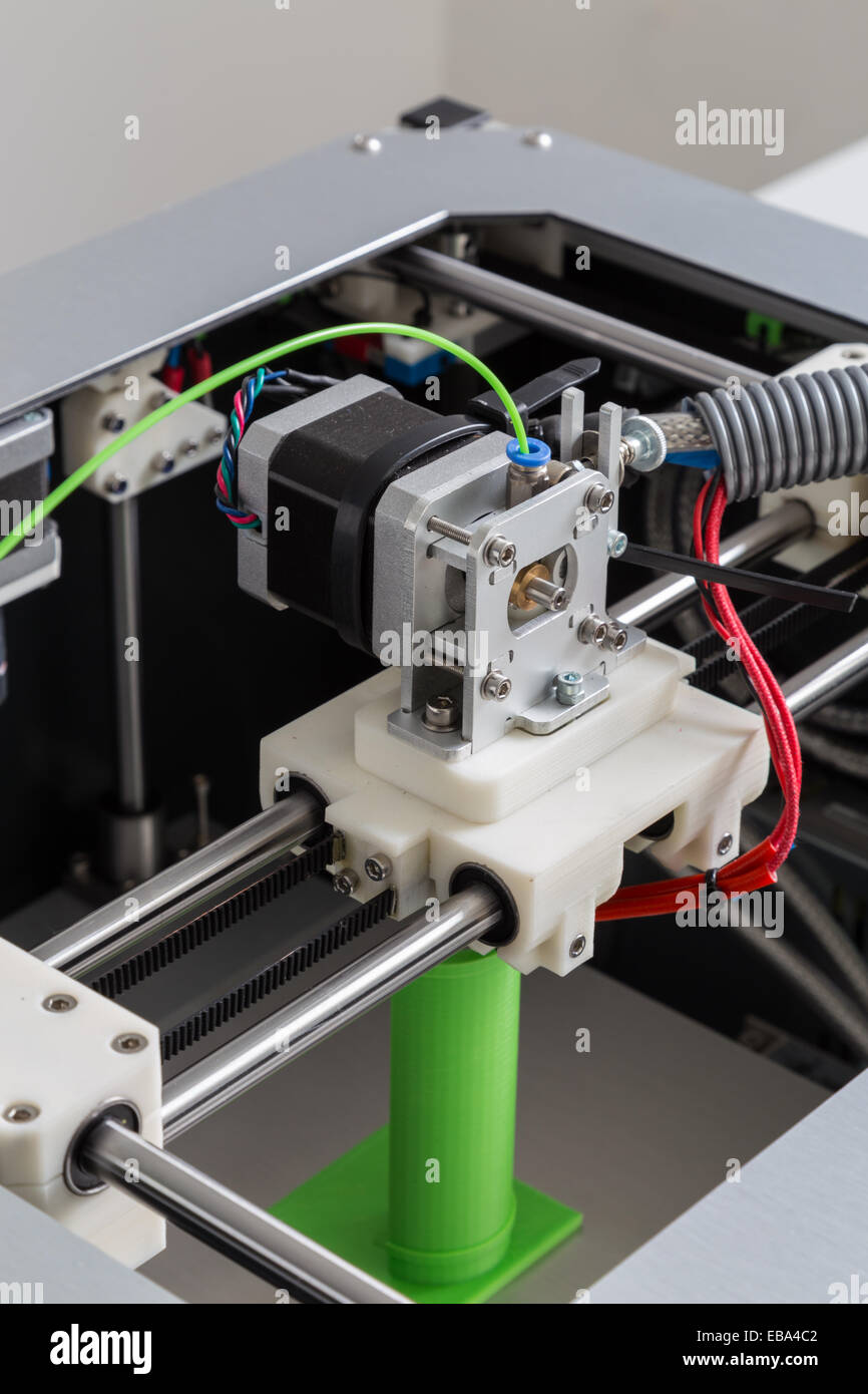 3d printer with bright green filament Stock Photo - Alamy