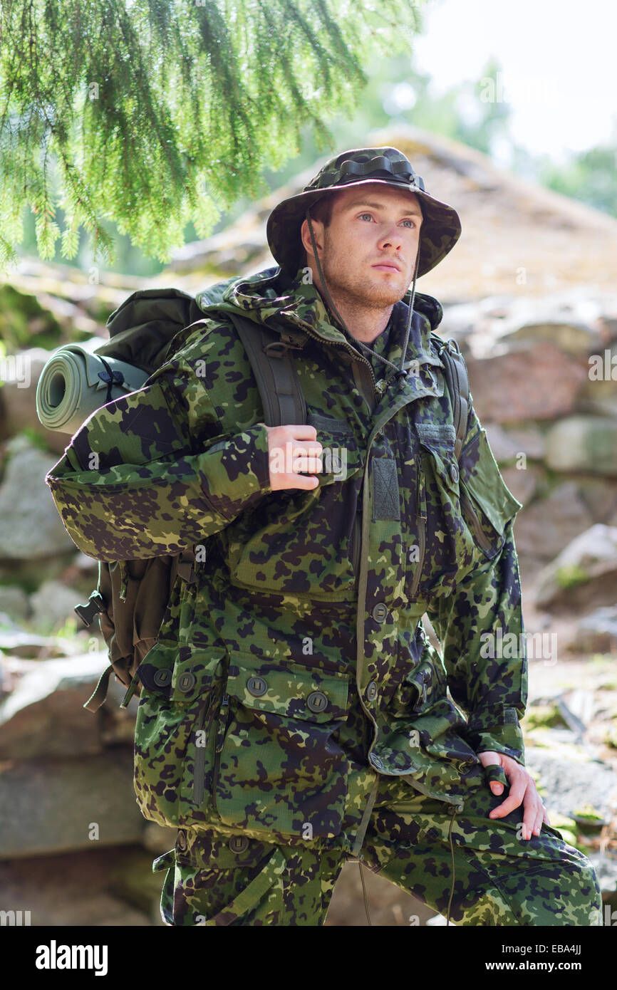 young soldier with backpack in forest Stock Photo - Alamy