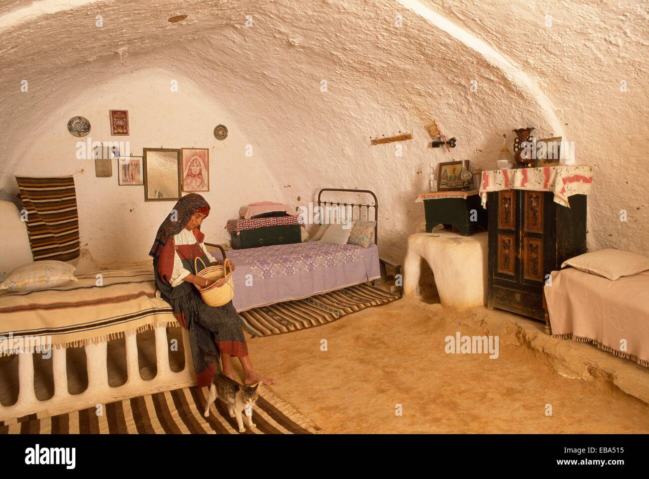 Fatima inside a cave house Matmata Southern Tunisia Stock Photo ...