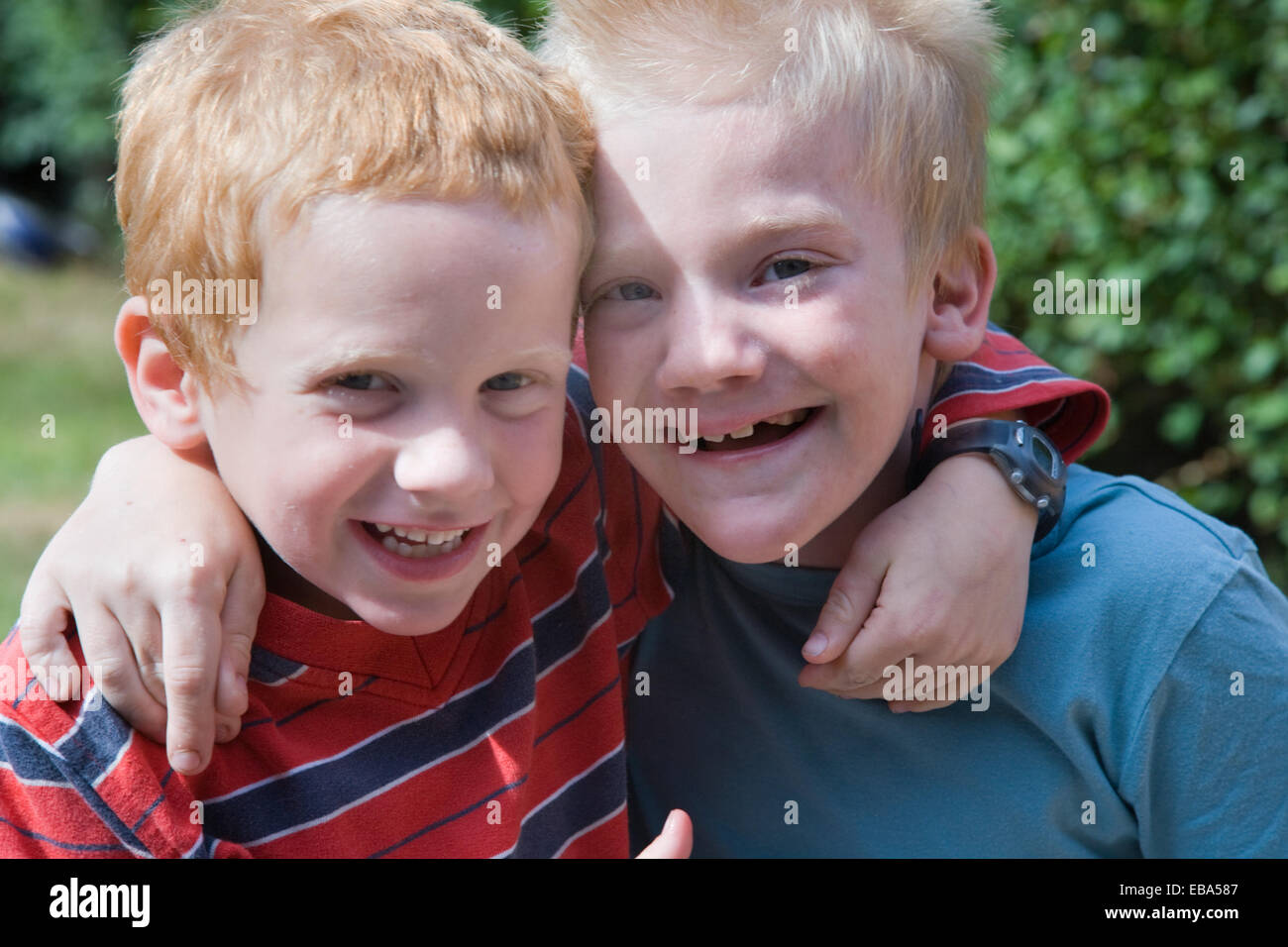 Two brothers hugging Stock Photo - Alamy