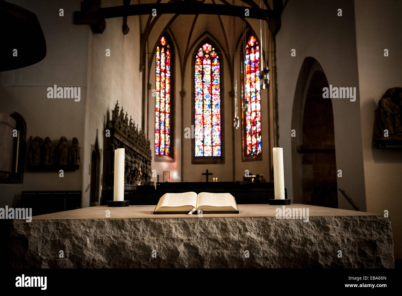 Bible open in stone altar Stock Photo - Alamy