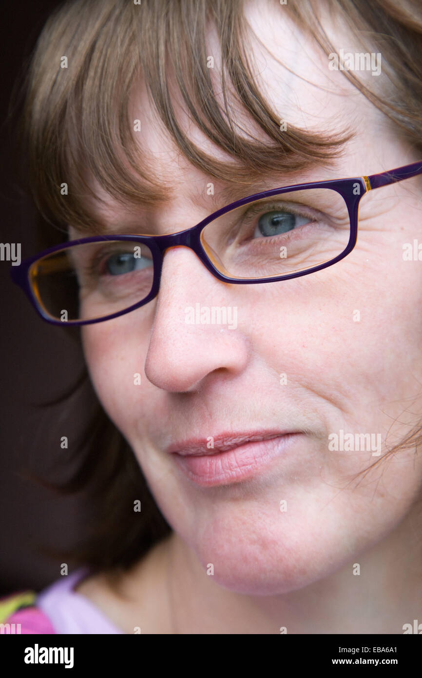 Portrait of a woman looking thoughtful Stock Photo - Alamy