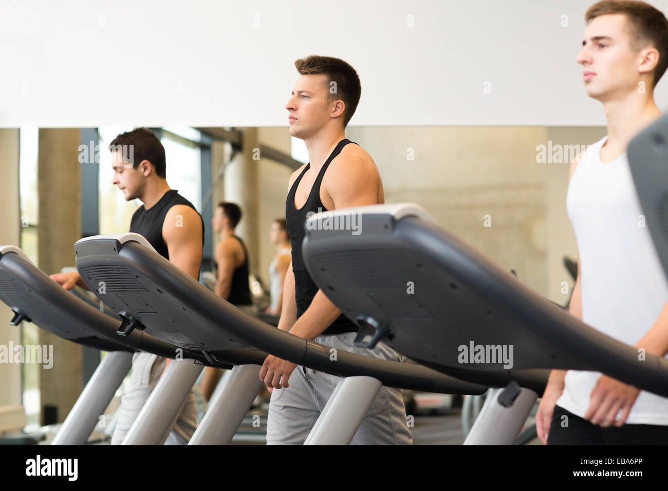group of men exercising on treadmill in gym Stock Photo - Alamy