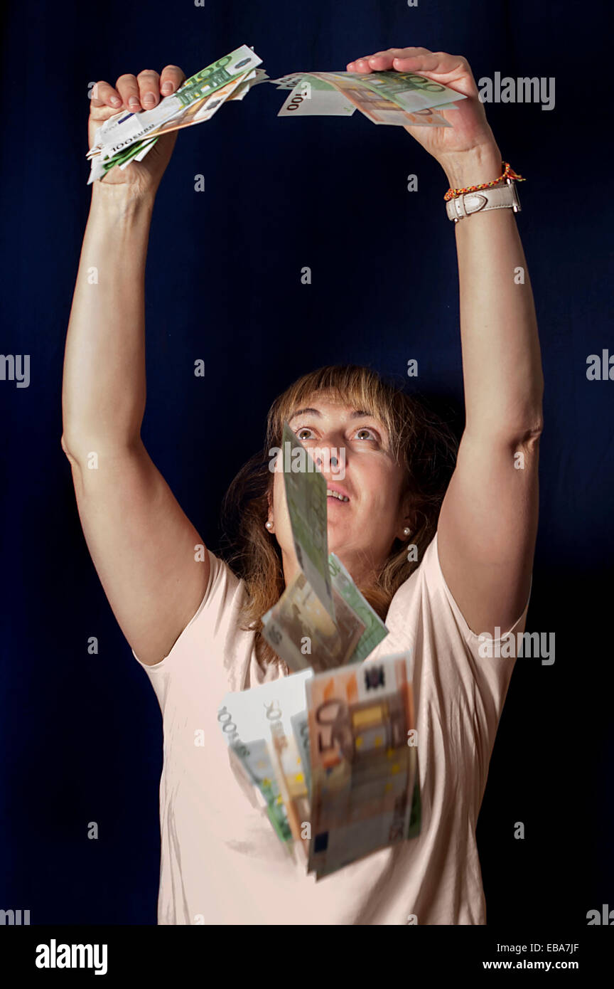 Money falling hands hi-res stock photography and images - Alamy